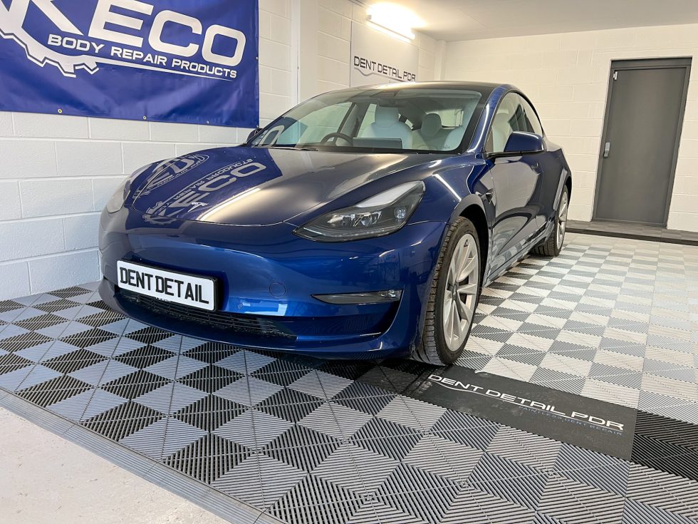 Paintless dent repair on a Tesla - Dent Detail